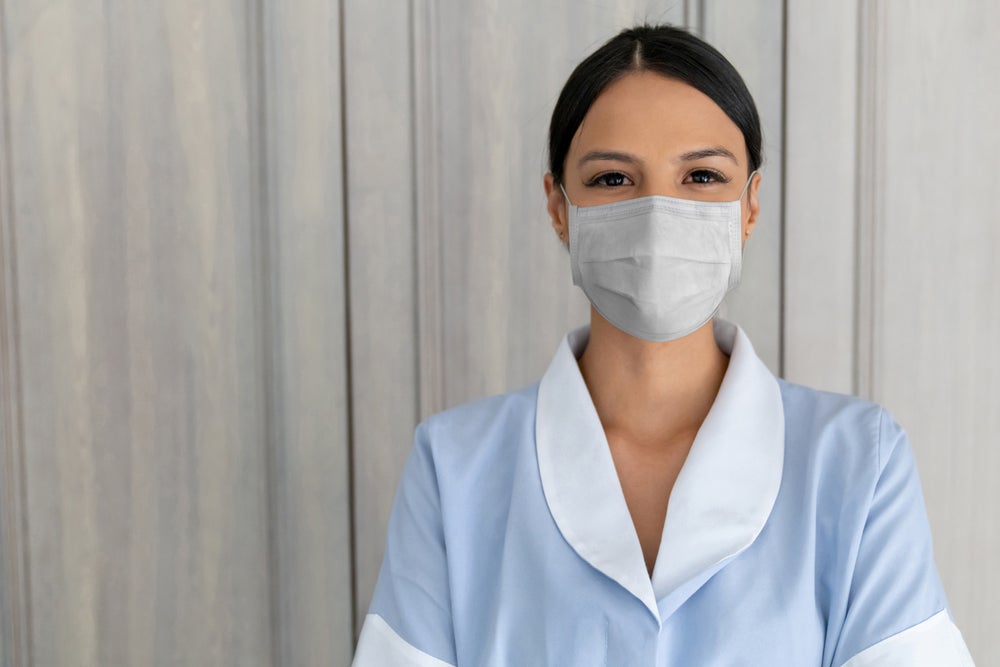 From behind the Coronavirus Mask, an Unseen Smile Can Still Be Heard ...